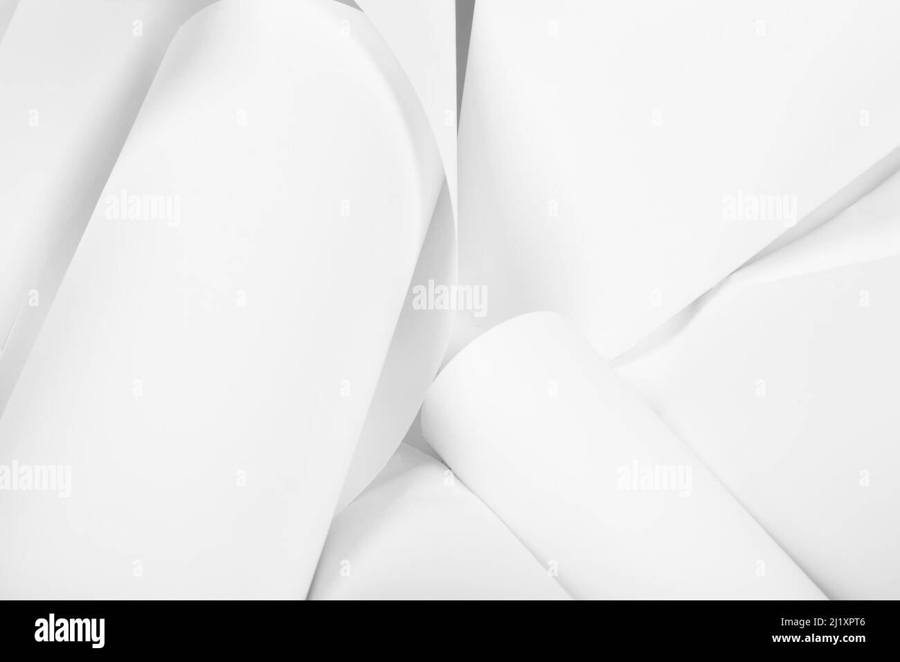 White sheets of office paper are twisted and scattered. Paper white ...
