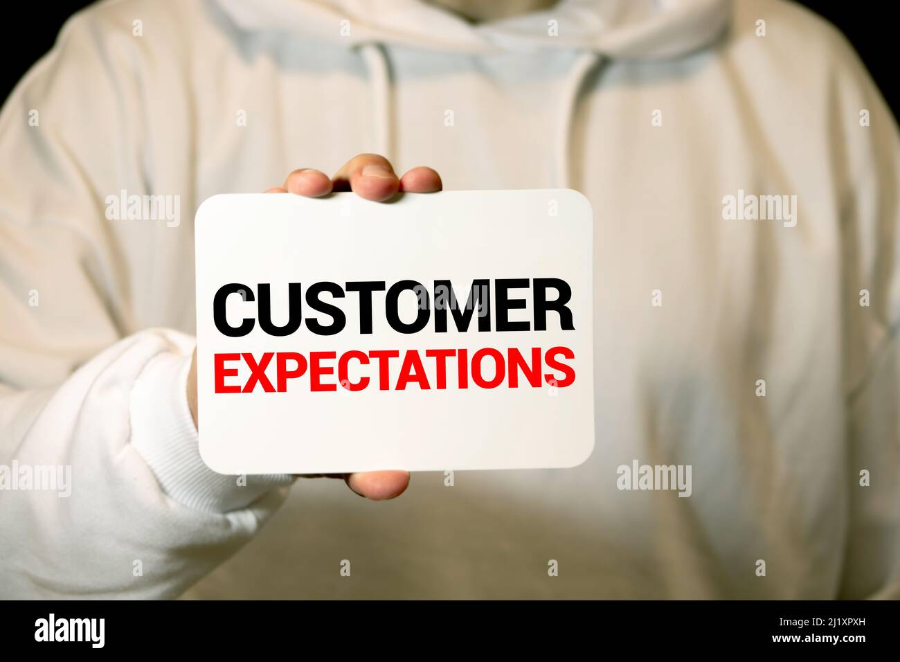 Hand writing the text: Customer Expectations. concept Stock Photo - Alamy