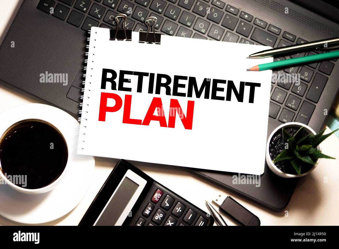 Retirement Plan word written on paper, concept Stock Photo - Alamy