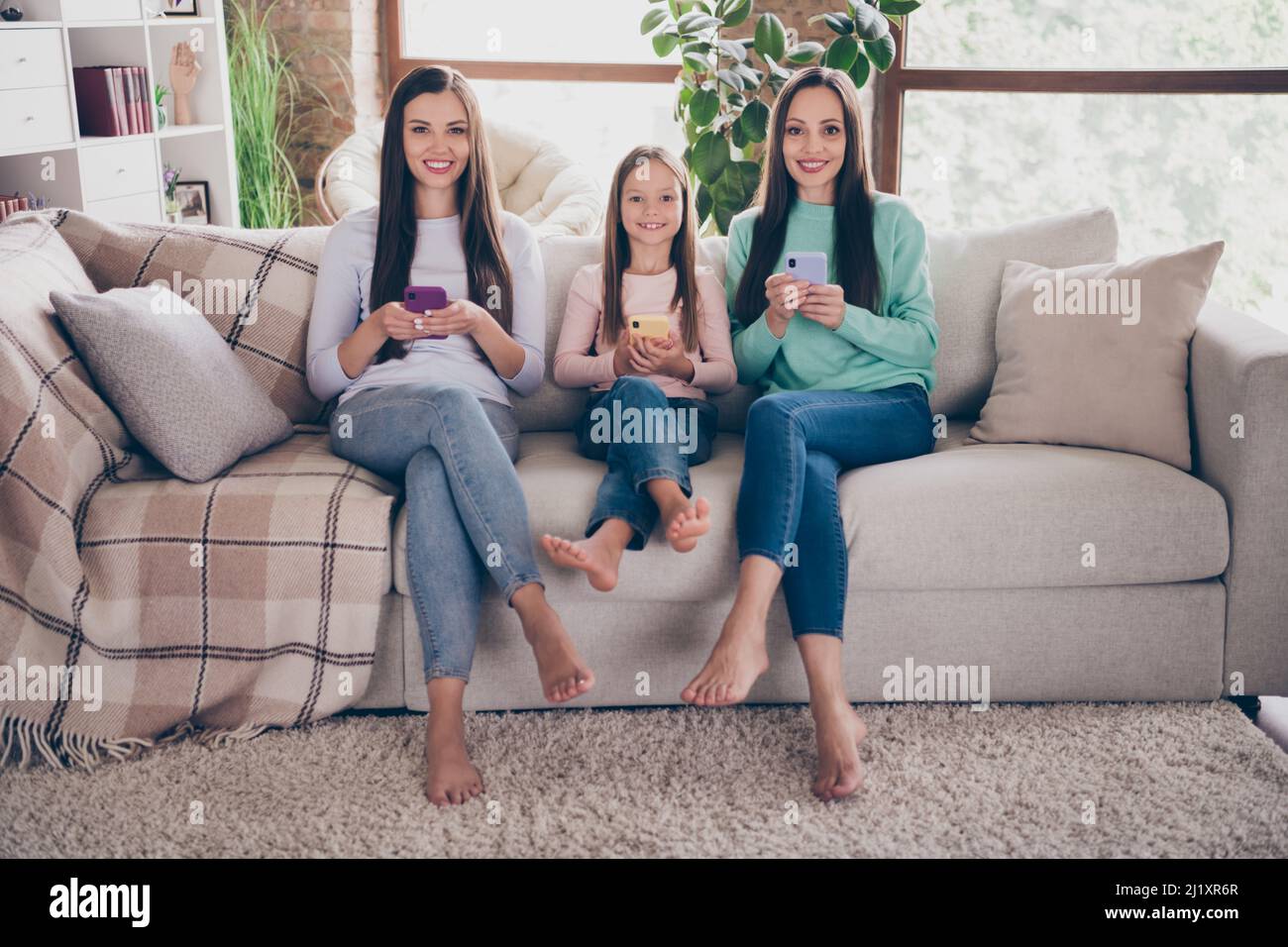 Full body photo of cheerful ladies free-time use cellphone blogger post ...