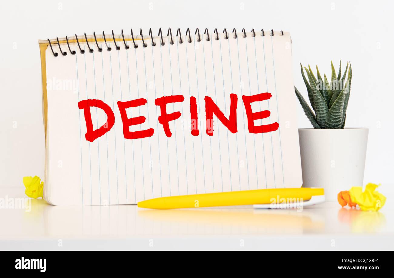Define. Define word on notebook sheet with some colorful crumpled paper ...