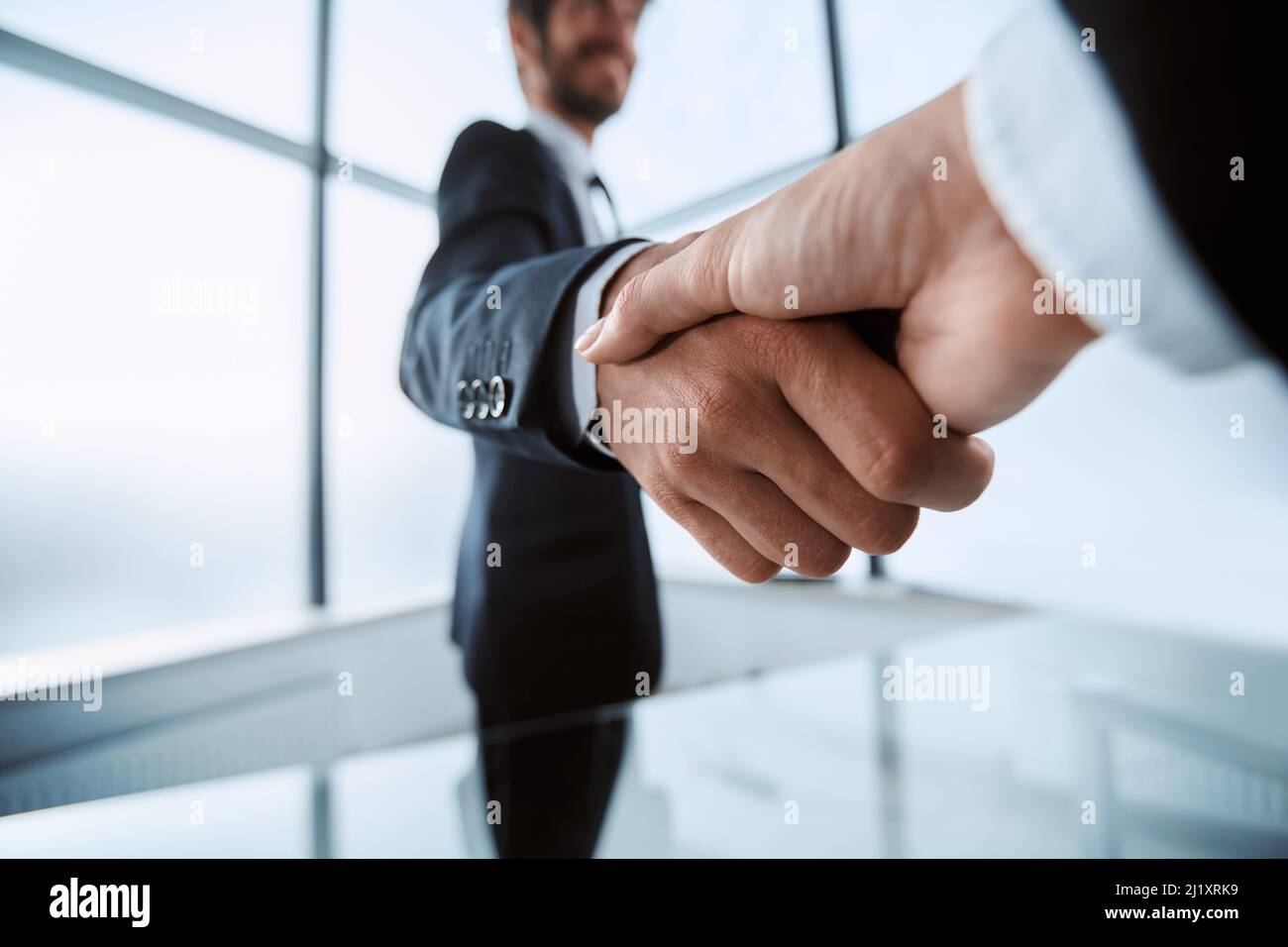 image is a confident handshake of business partners Stock Photo - Alamy