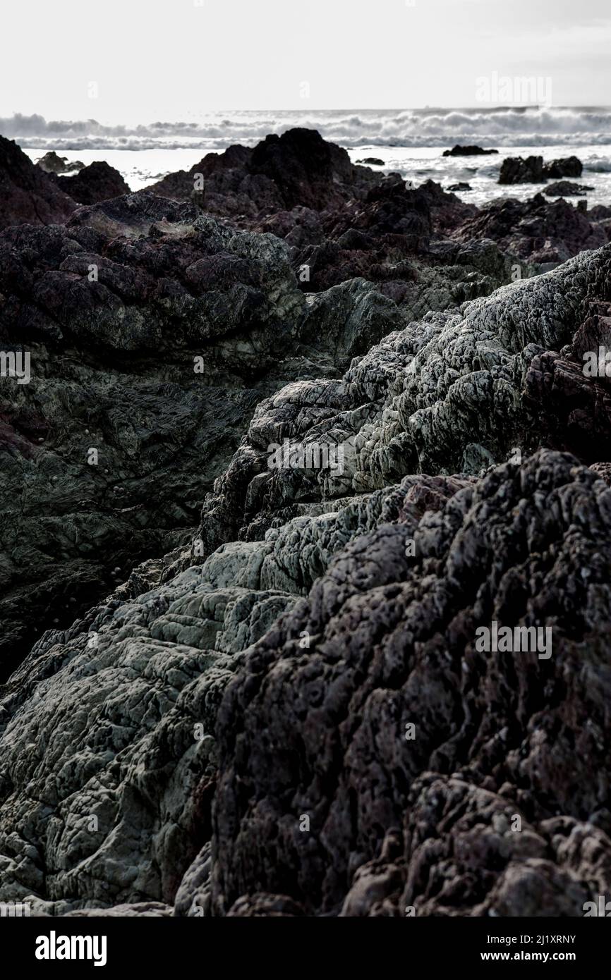 Bright sunlight sparkling off of the surface of the sea as the tide ...