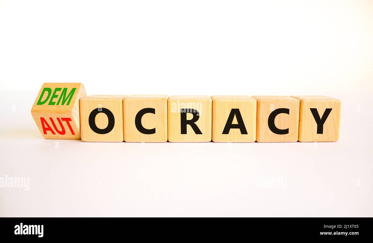 Democracy or autocracy symbol. Turned wooden cubes and changed the ...