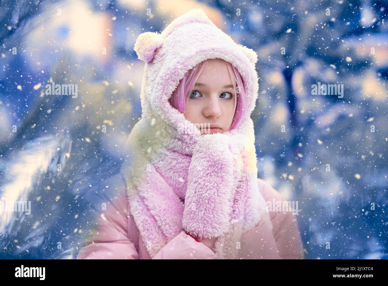 Fairytale portrait of a beautiful girl with pink hair on a winter ...