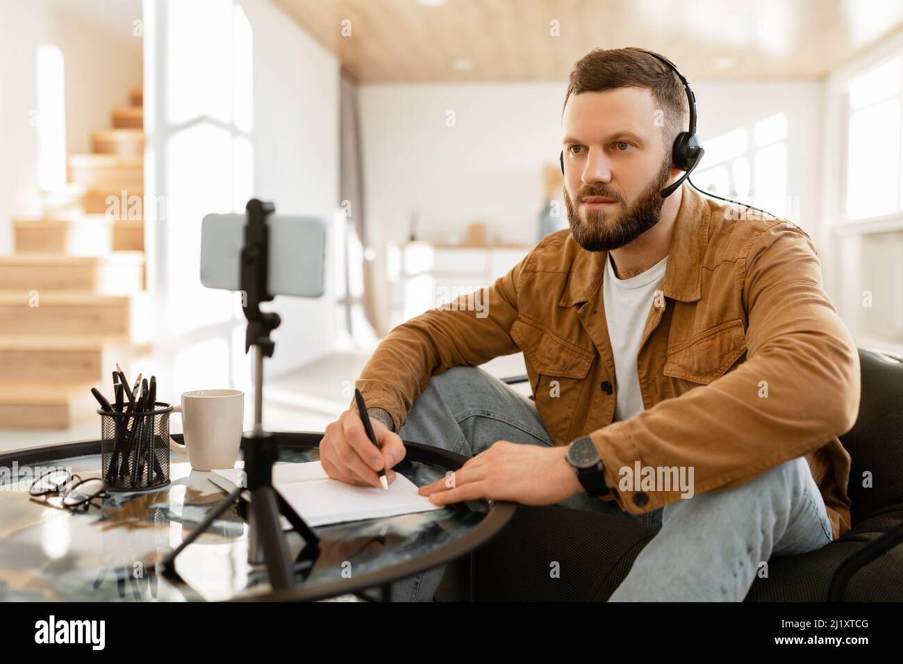 Man Taking Notes Making Video Call Via Smartphone Indoor Stock Photo ...