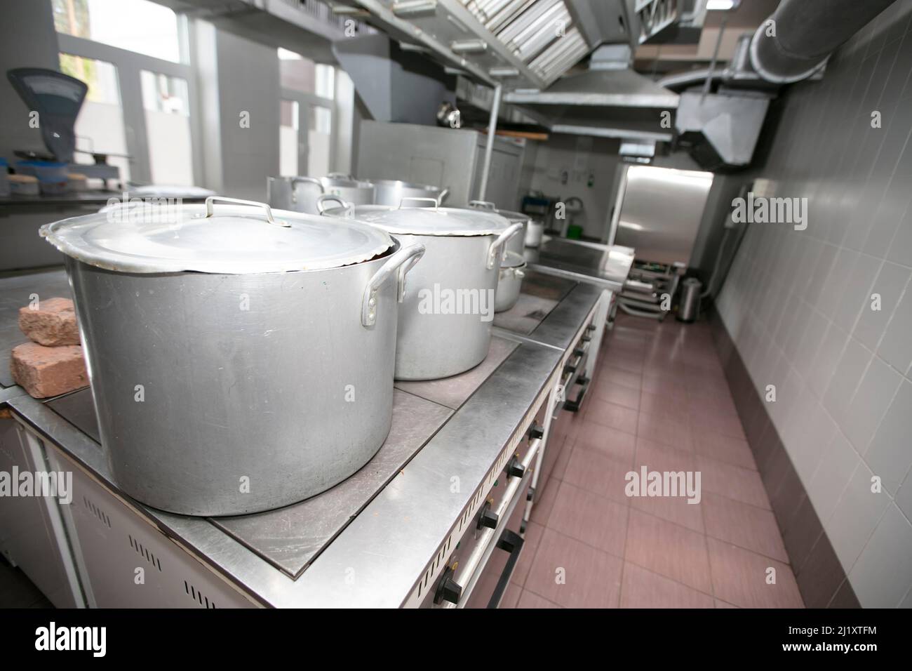 Industrial kitchen with large metal pans Stock Photo - Alamy