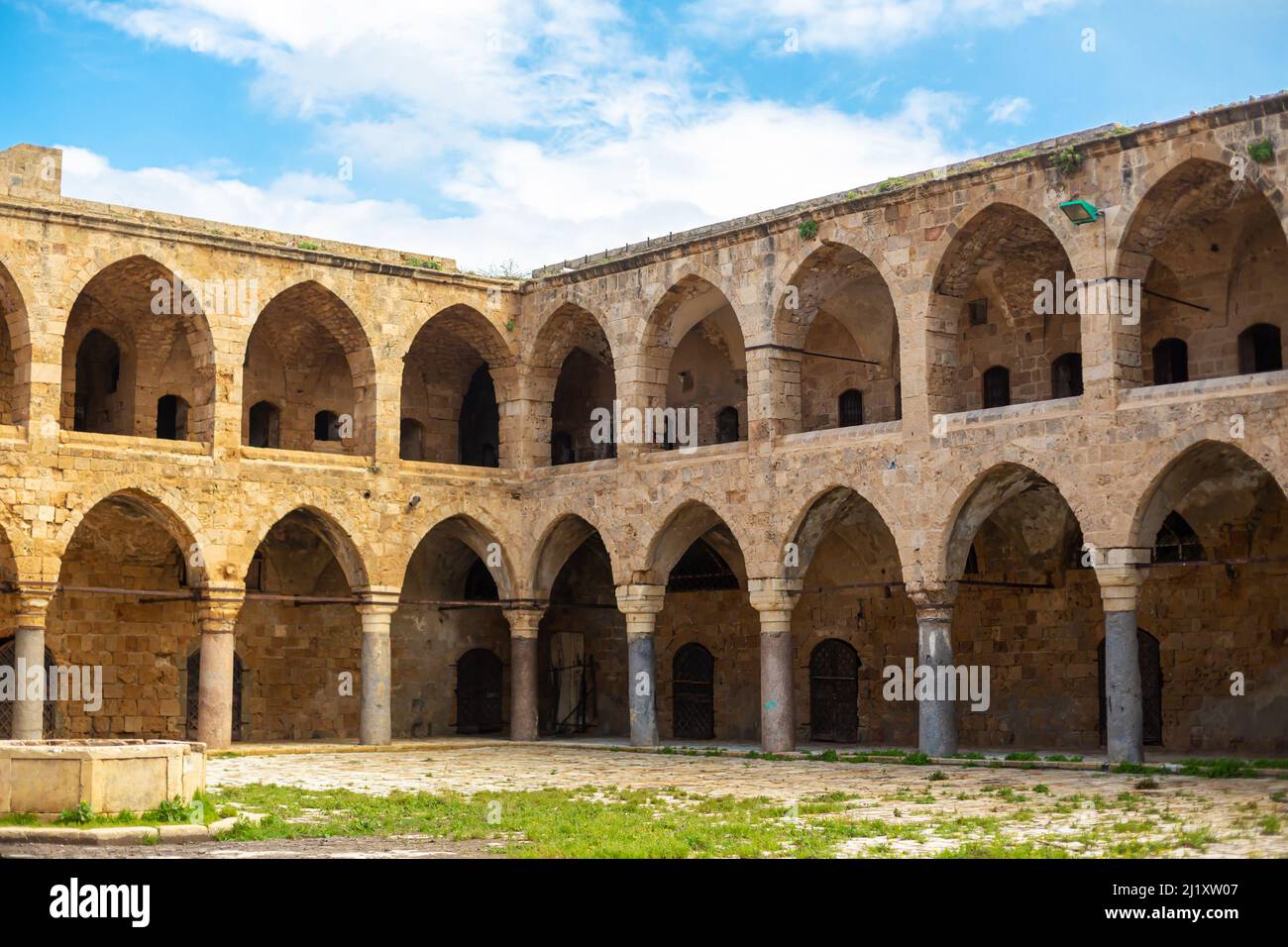 Medieval square building with a courtyard and many arches Stock Photo ...