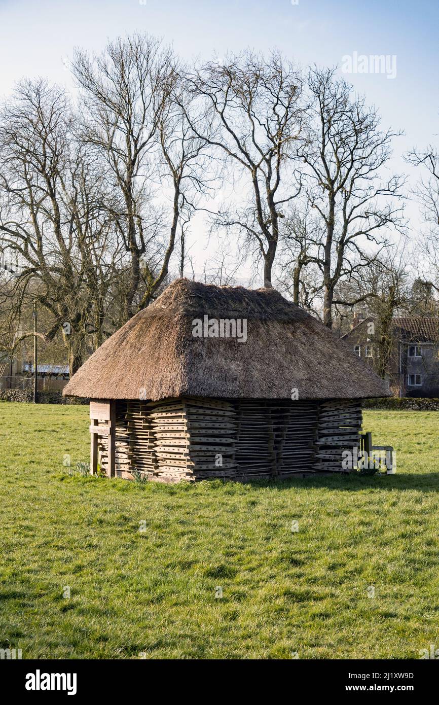 UK, England, Somerset. Priddy village green. A stack of Hurdles was ...