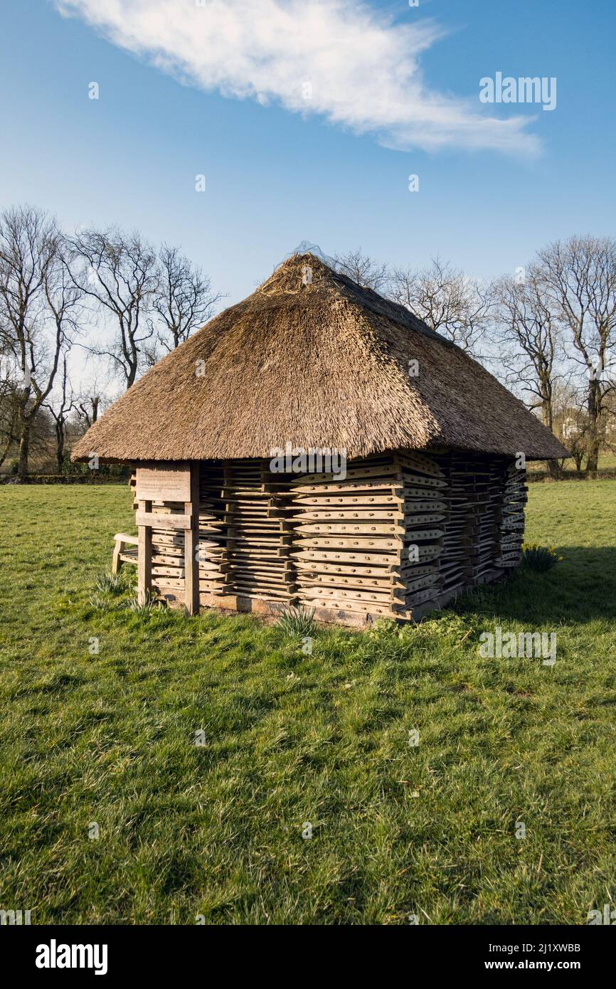 UK, England, Somerset. Priddy village green. A stack of Hurdles was ...
