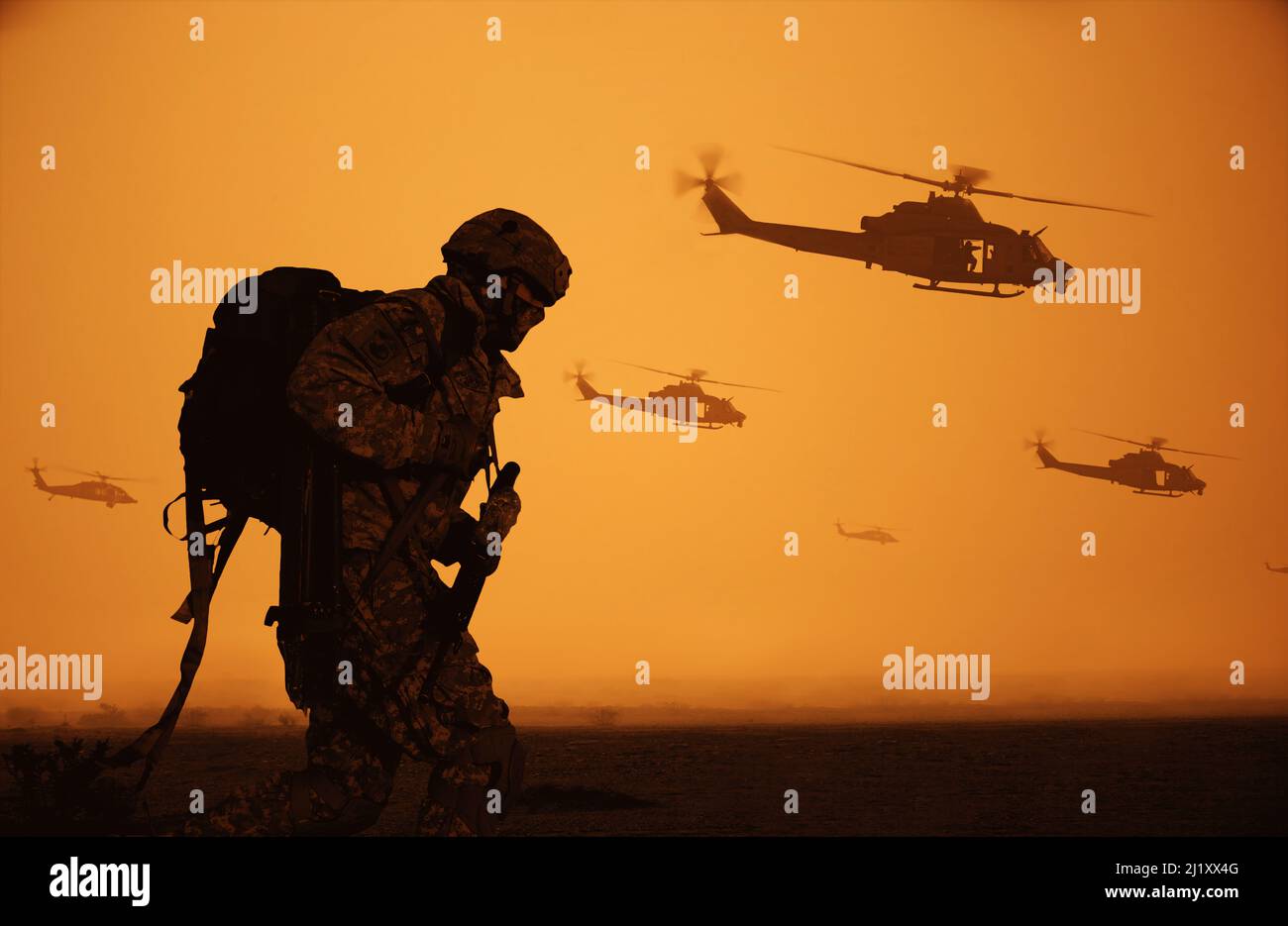 Military troops and helicopter on the way to the battlefield at sunset ...