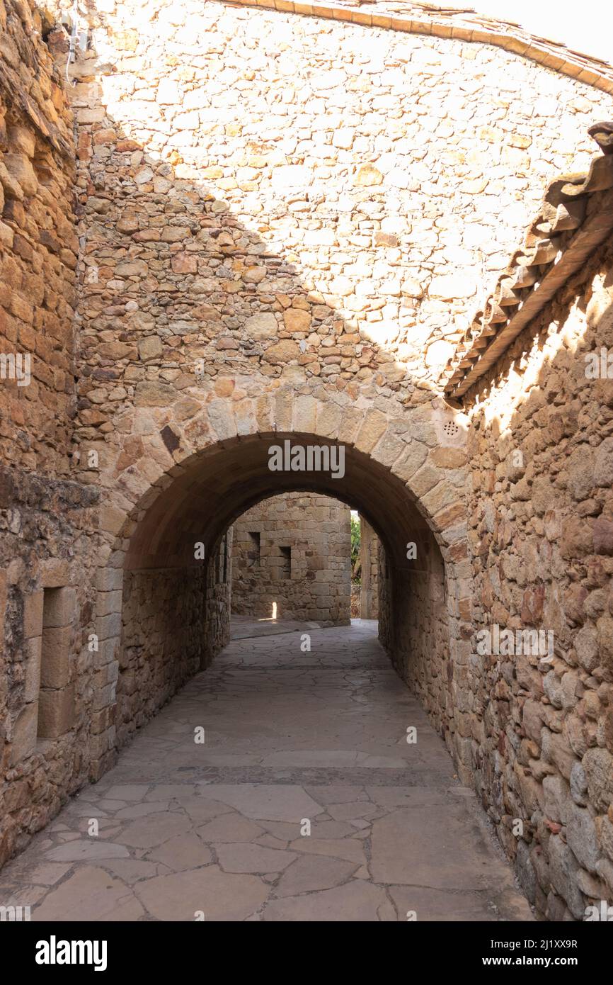 stone alley in the medieval town of pals on the costa brava Stock Photo ...
