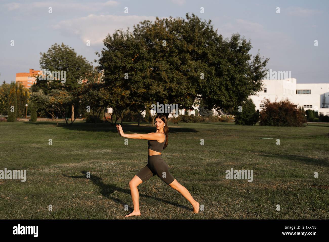 Qigong meditation exercises outdoor. Fit asian girl does chinese ...