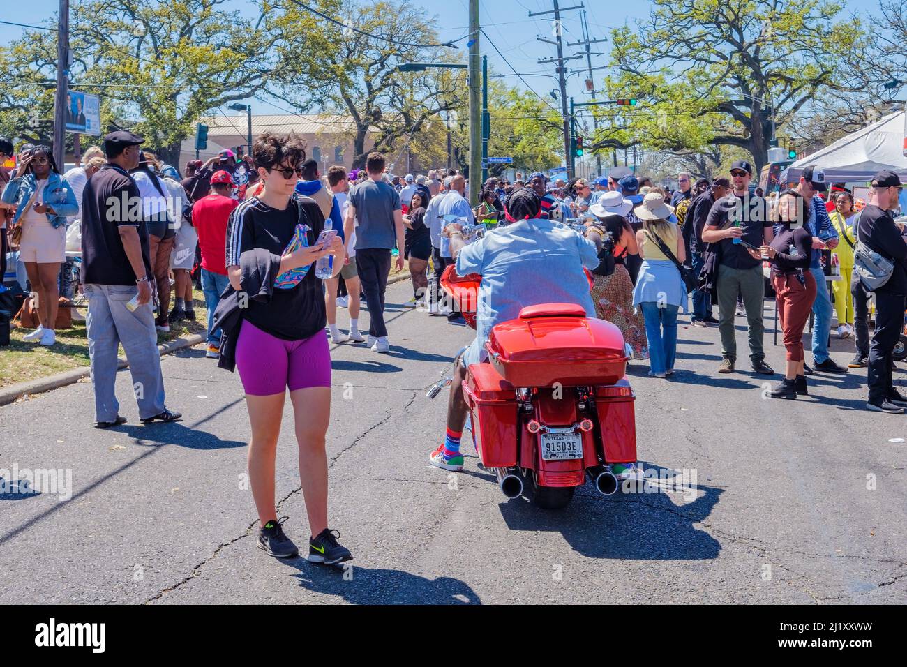 NEW ORLEANS, LA, USA - MARCH 20, 2022: Man pushes through crowd on ...