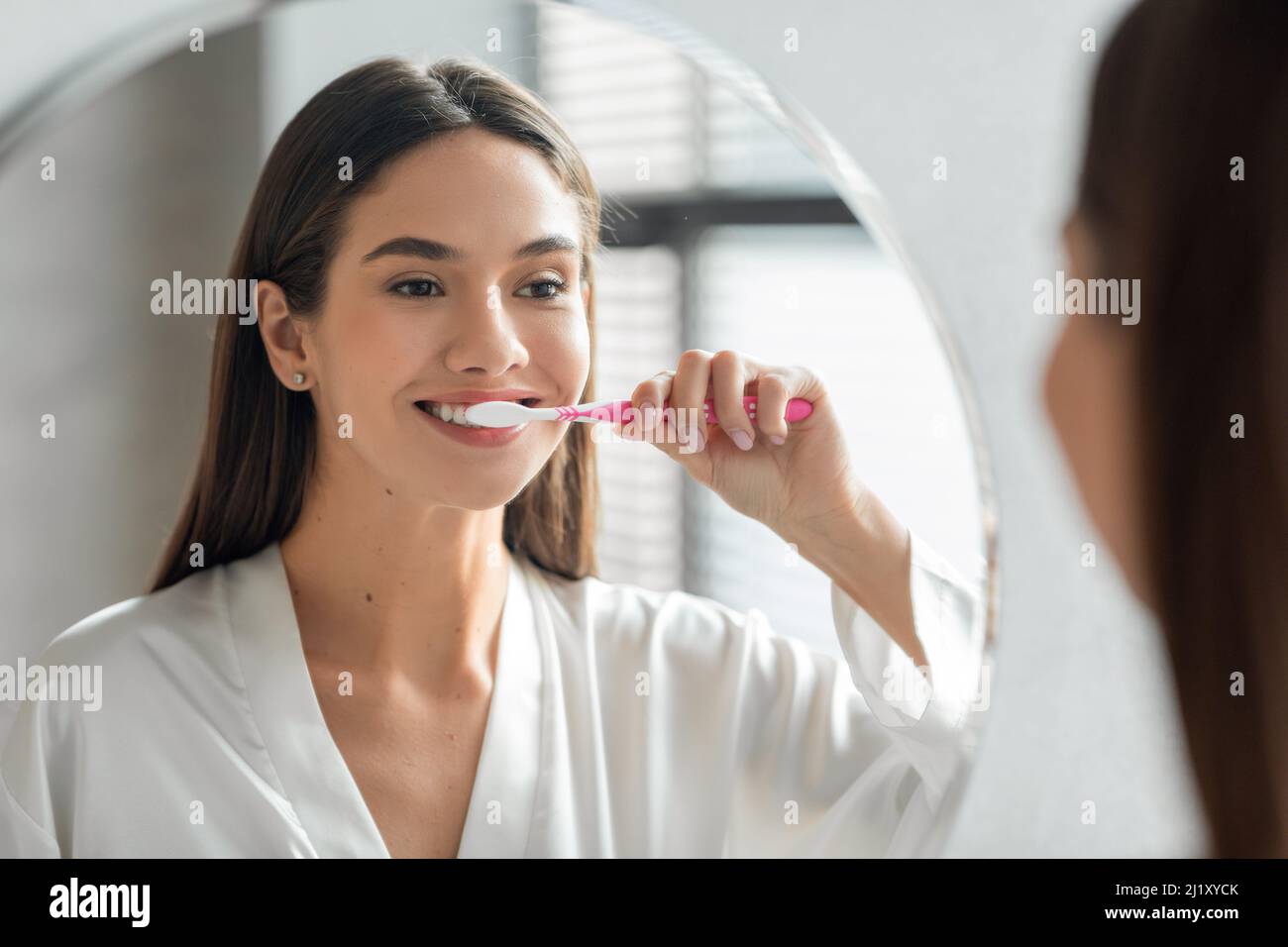 Morning Hygiene. Portrait Of Attractive Young Lady Brushing Teeth Near ...