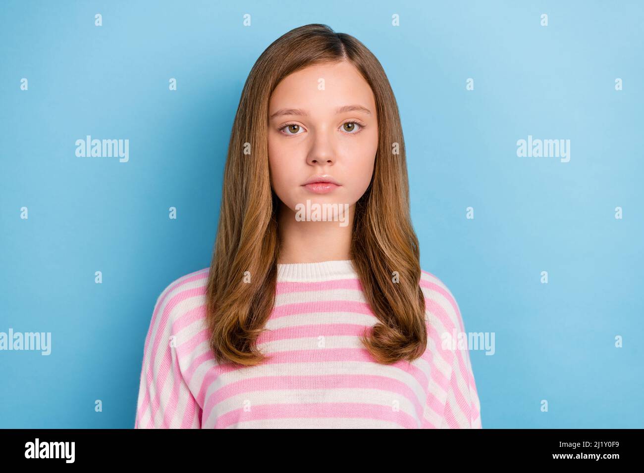 Photo of nice small girl wear white shirt isolated on blue color ...