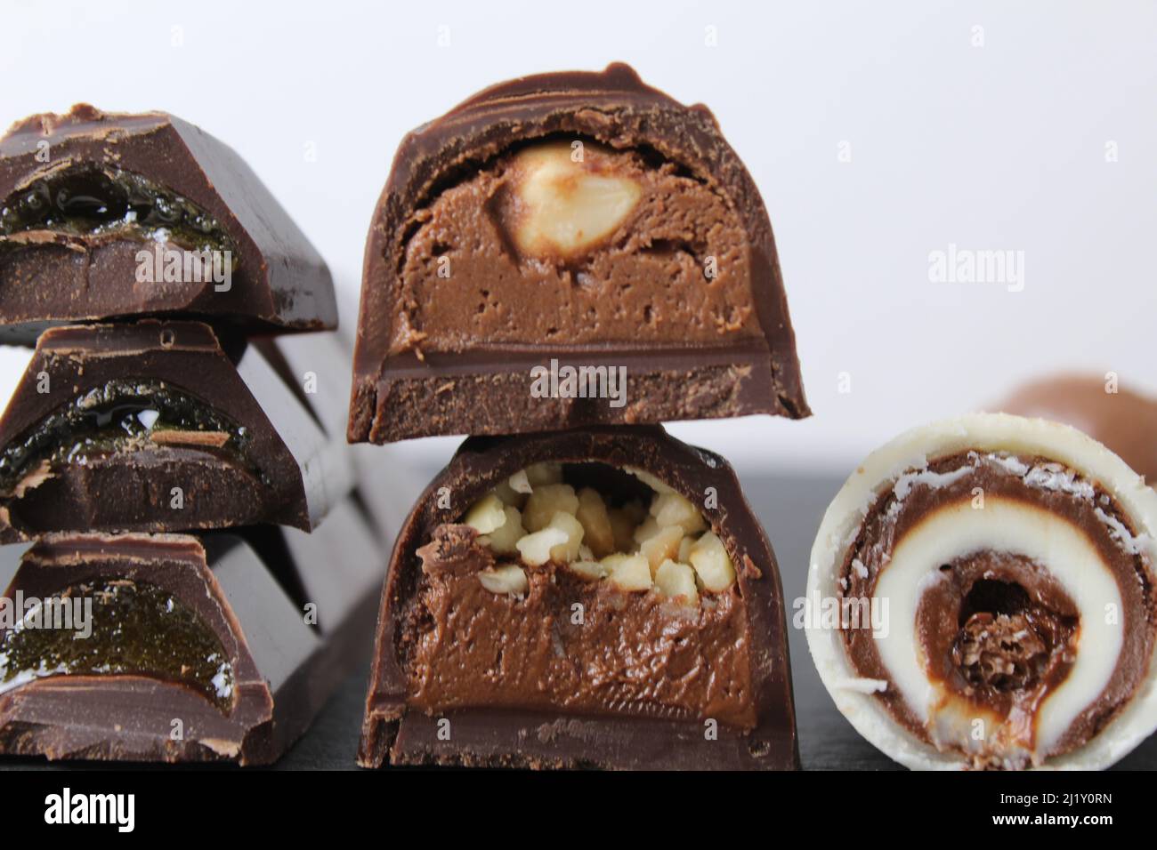 background of candy candy chocolate. sweets in section with fillings of ...