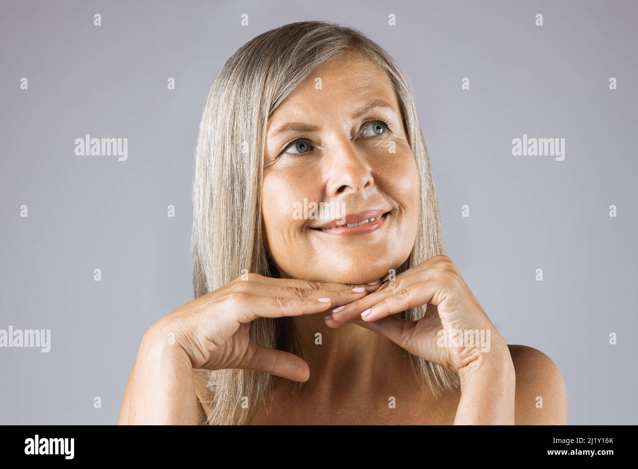 Portrait of grey haired woman with natural beautiful wrinkles on face ...