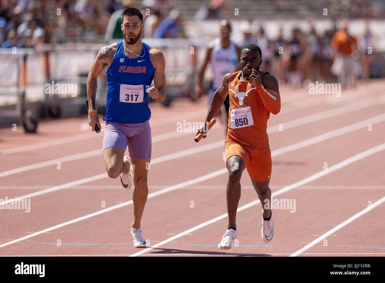 Jacob Miley of Florida and Marcellus Moore of Texas near the finish of ...