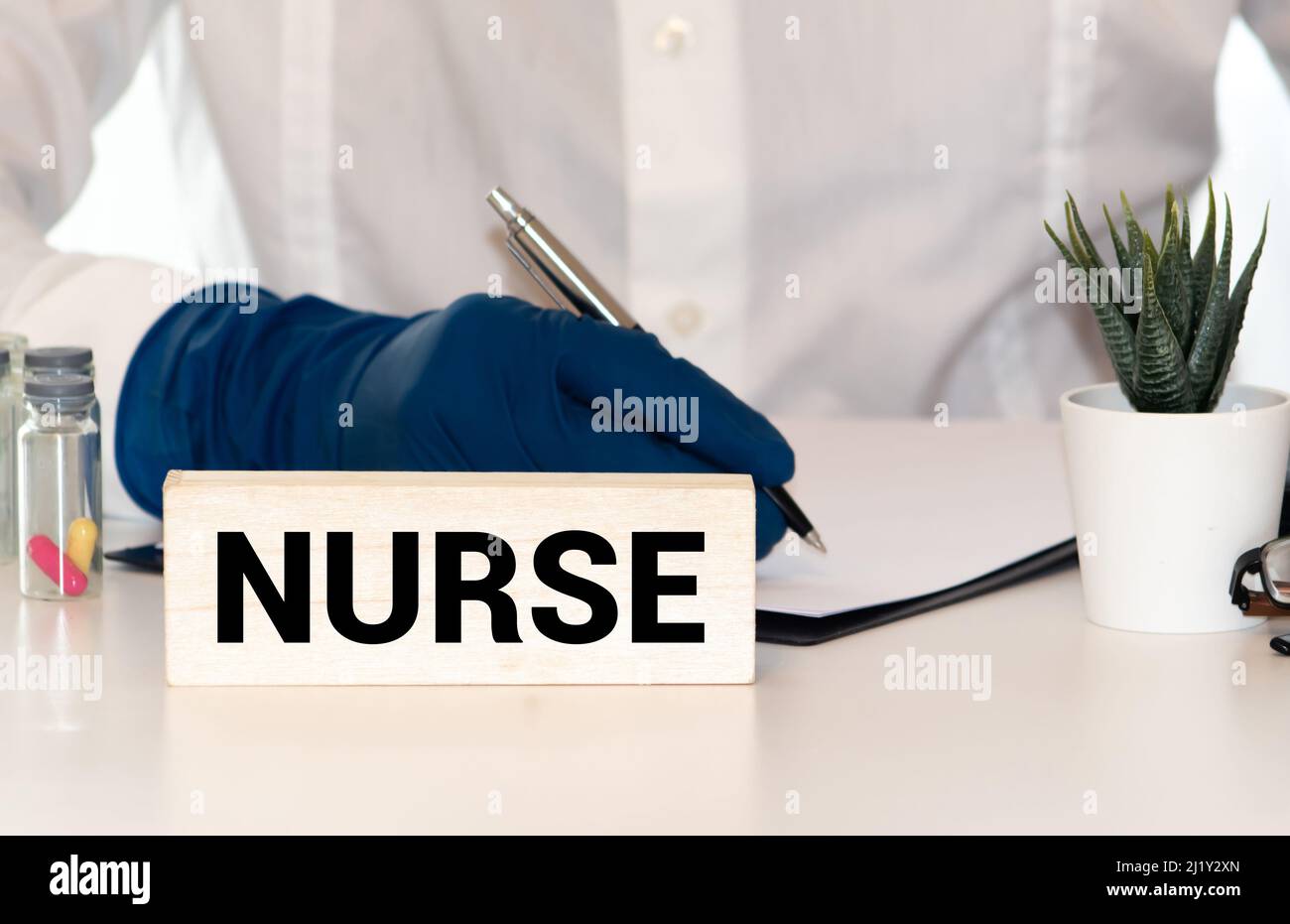 Nurse, word cube with background. medical concept Stock Photo - Alamy