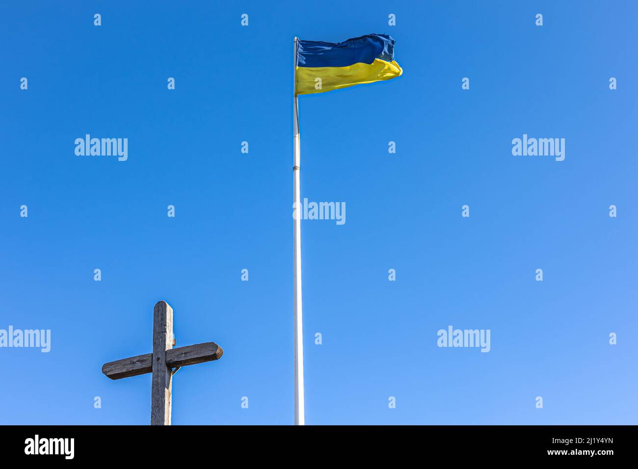 The crucifixion of Jesus Christ and the flag of Ukraine against the ...