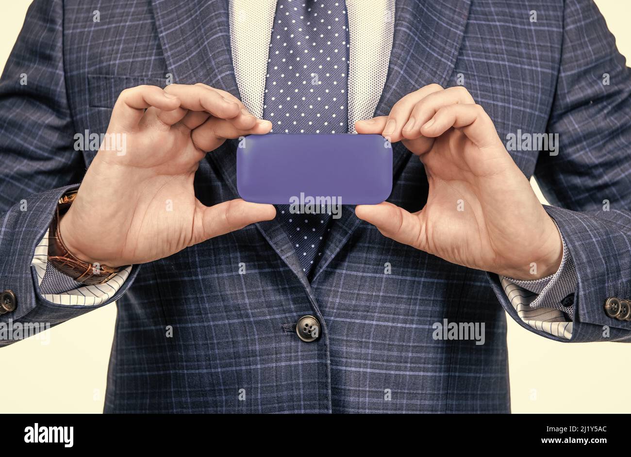 cropped businessman demonstrate modern gadget. successful ceo hold blue ...