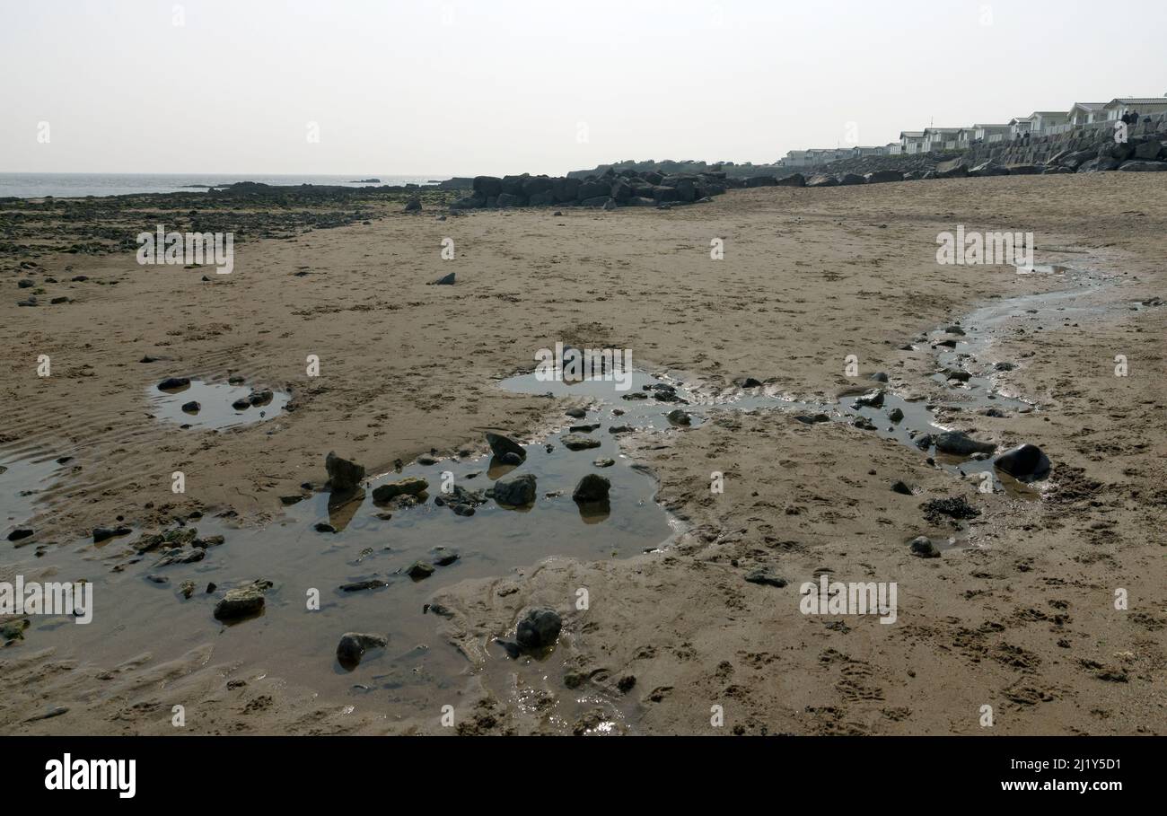 Small sandy pool on the beach at Newton near Porthcawl, South Wales ...