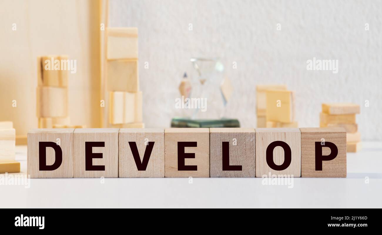 Develop word written on wood block. Develop text on cement table for ...