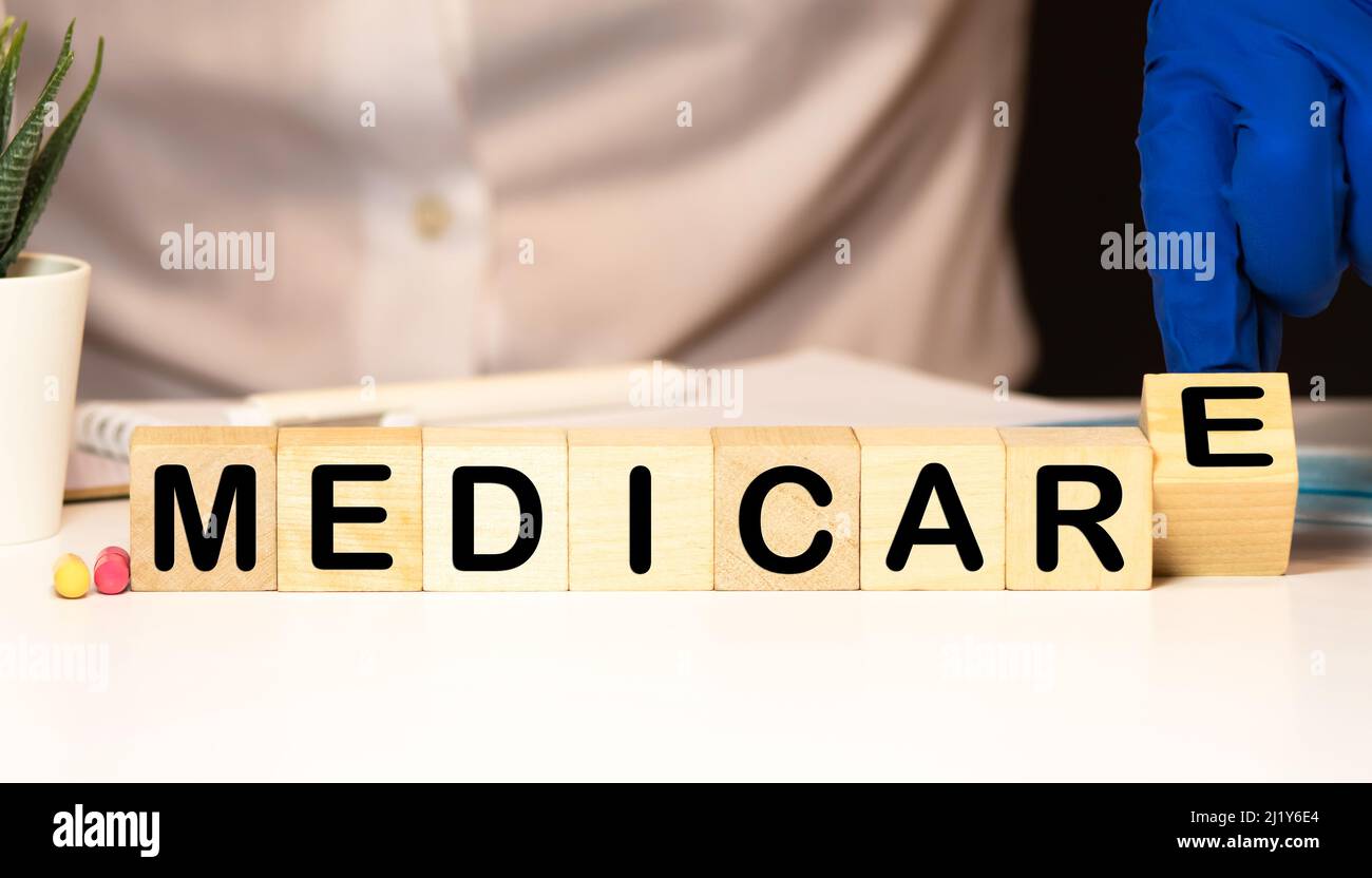 Medicare word - in letterpress wood block on white background Stock ...