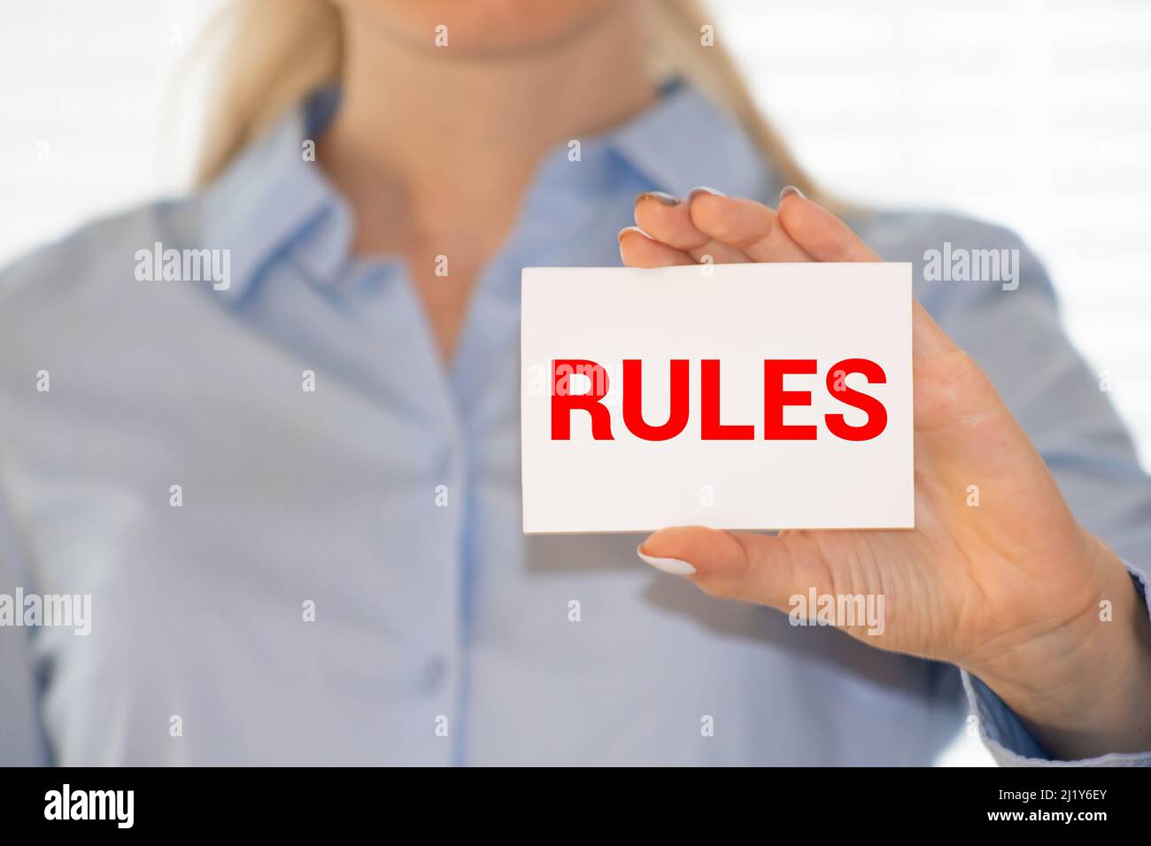 RULES word on the card shown by a woman, vintage tone Stock Photo - Alamy