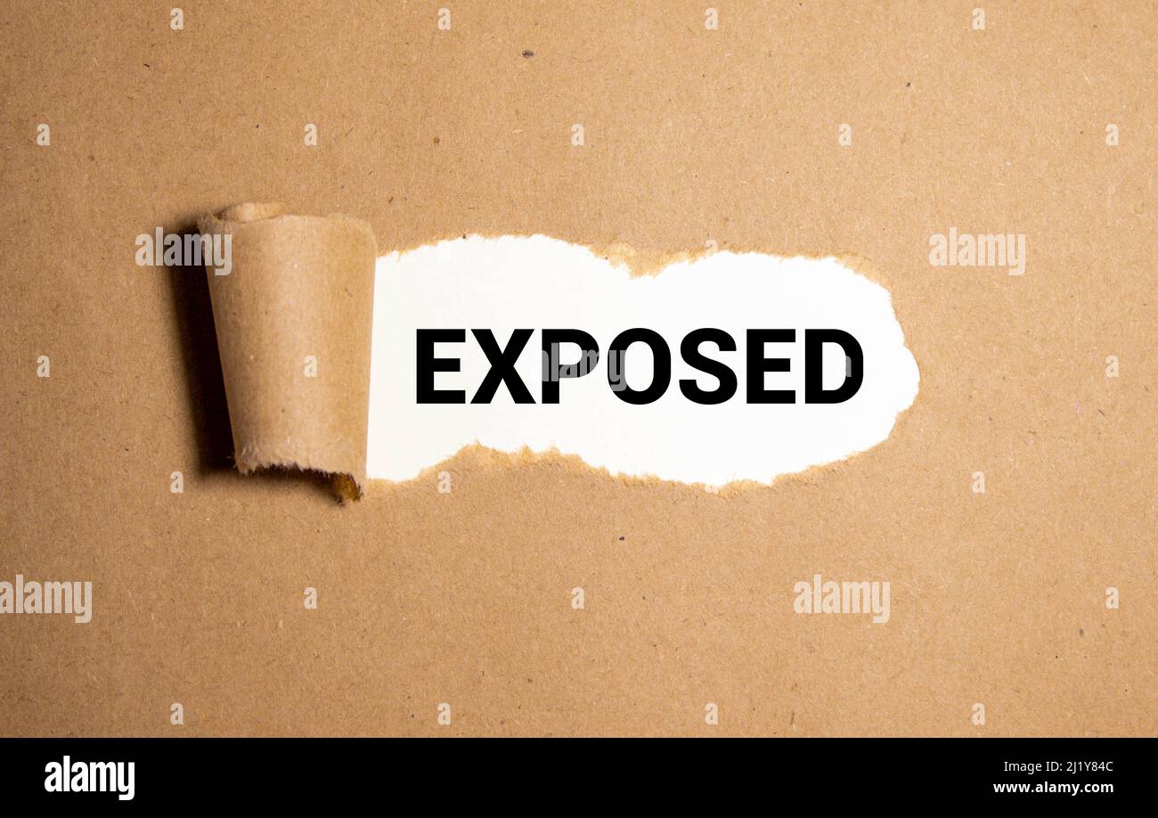 EXPOSED word written under torn paper. concept Stock Photo - Alamy