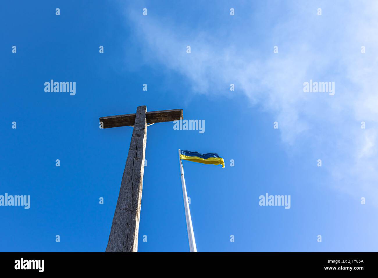 The crucifixion of Jesus Christ and the flag of Ukraine against the ...