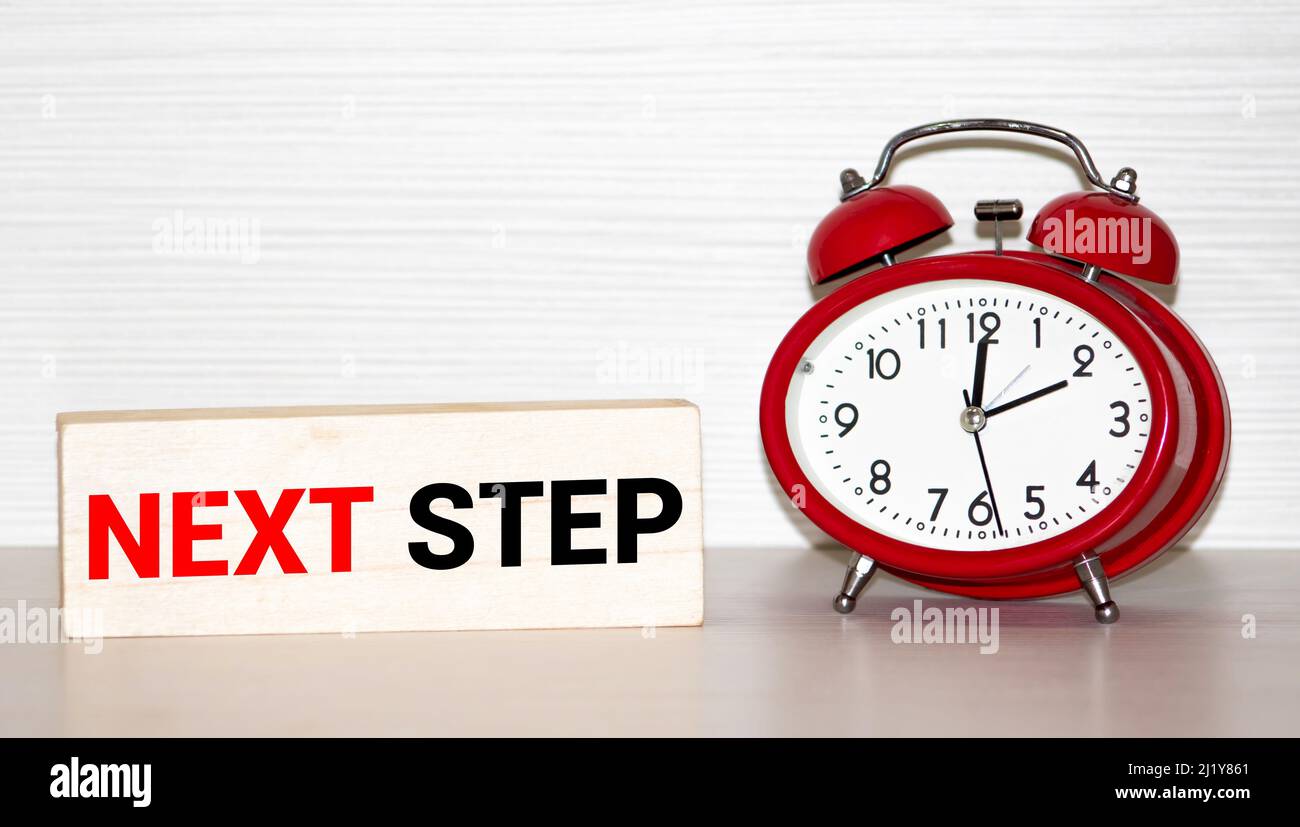 Next step text written on a diary, concept Stock Photo - Alamy