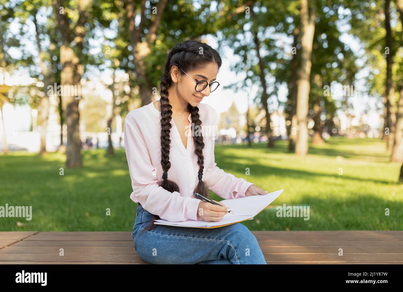 Indian girl sitting on bench hi-res stock photography and images - Alamy
