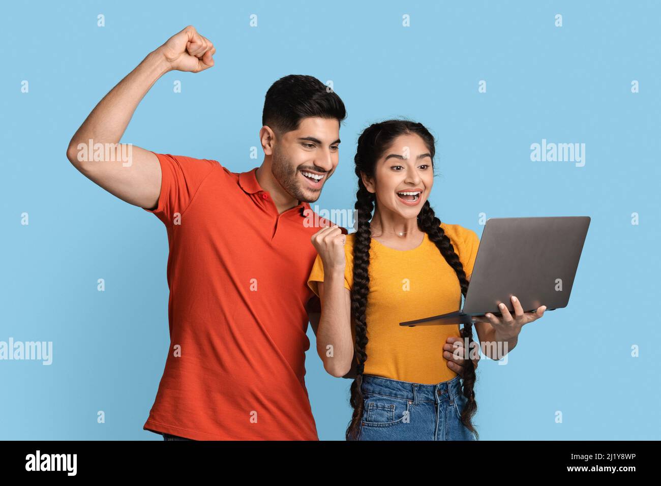 Excited young couple celebrating success hi-res stock photography and ...
