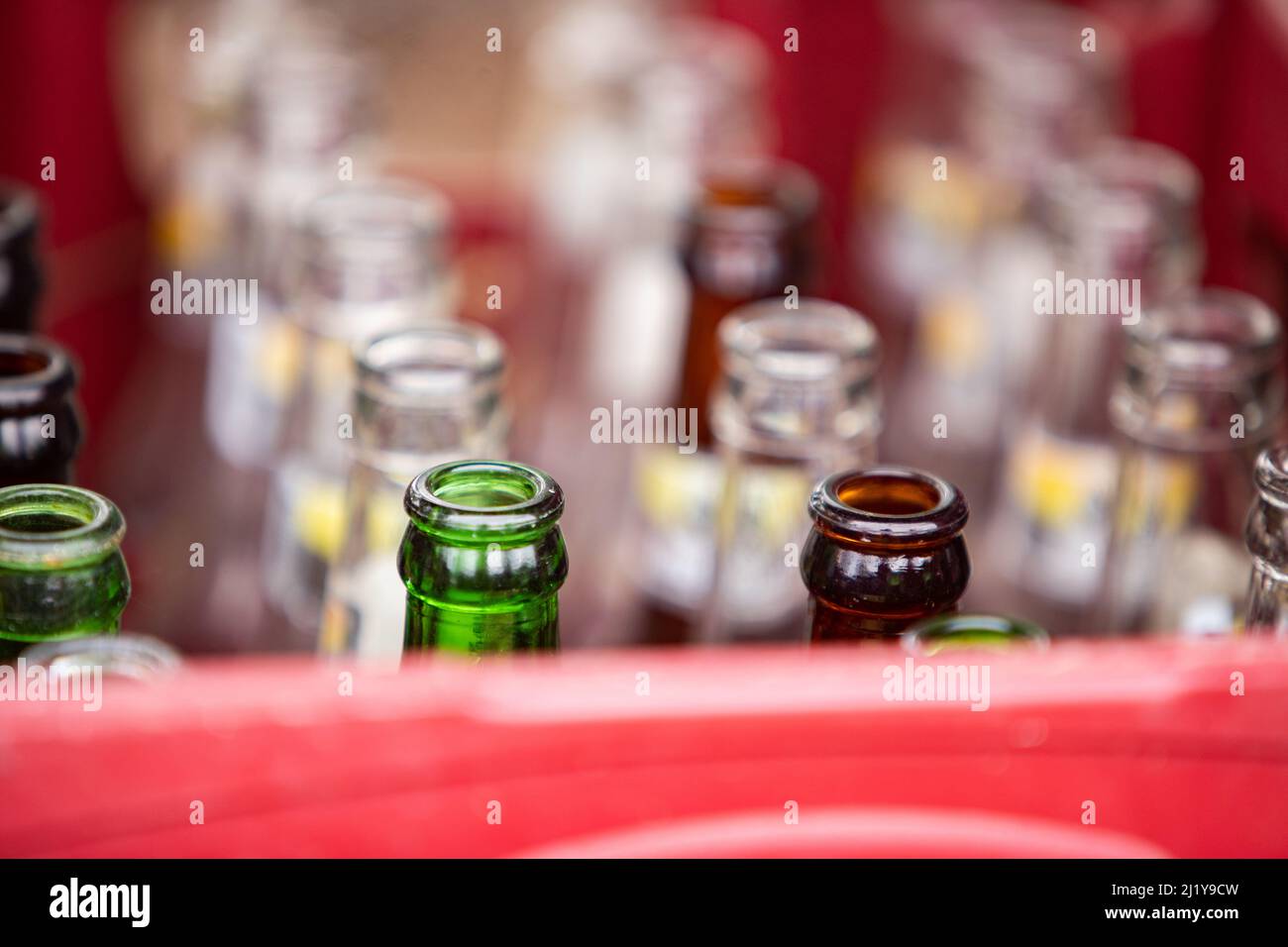 A selective focus shot of glass bottle tops in red box Stock Photo - Alamy