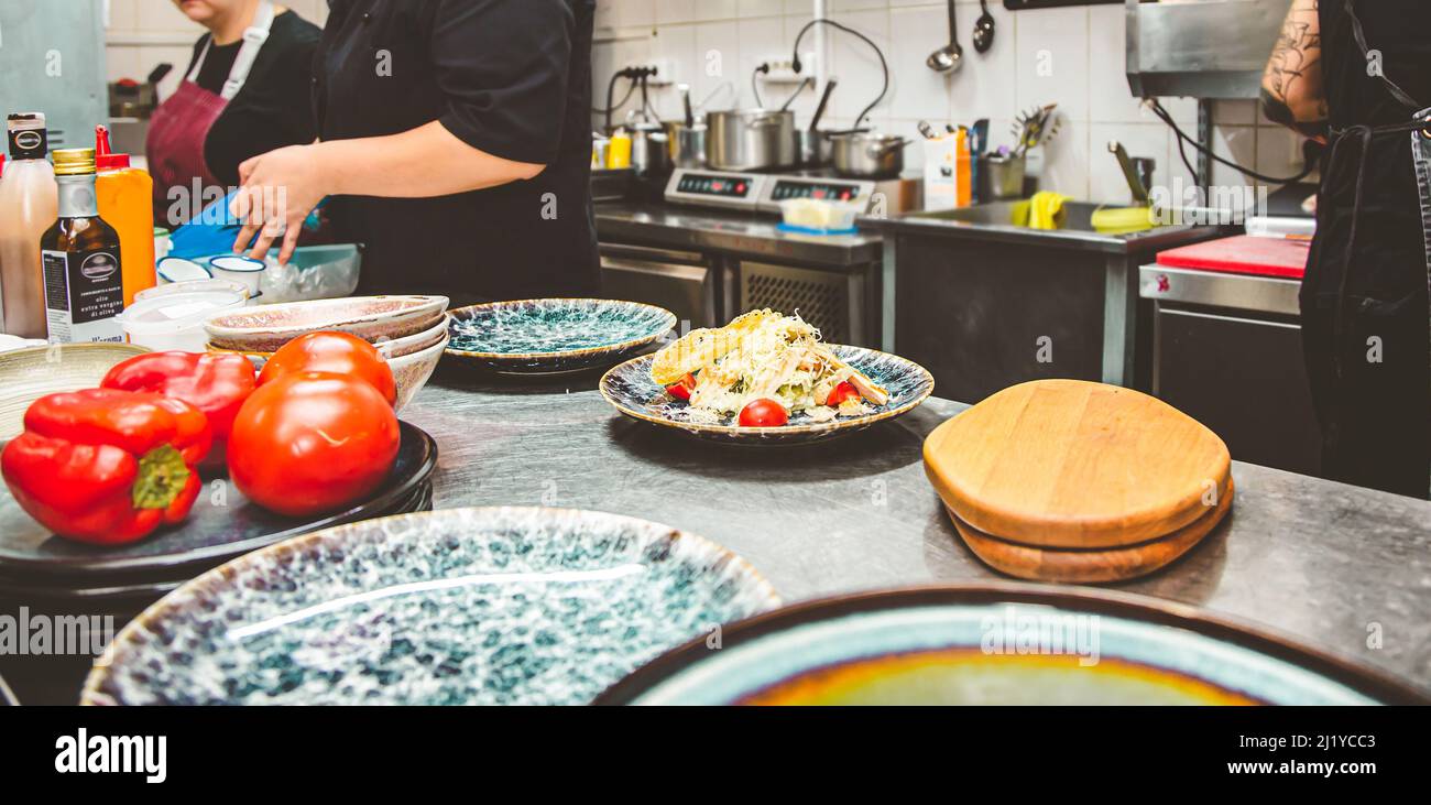 Professional chef cooking in the kitchen restaurant at the hotel ...