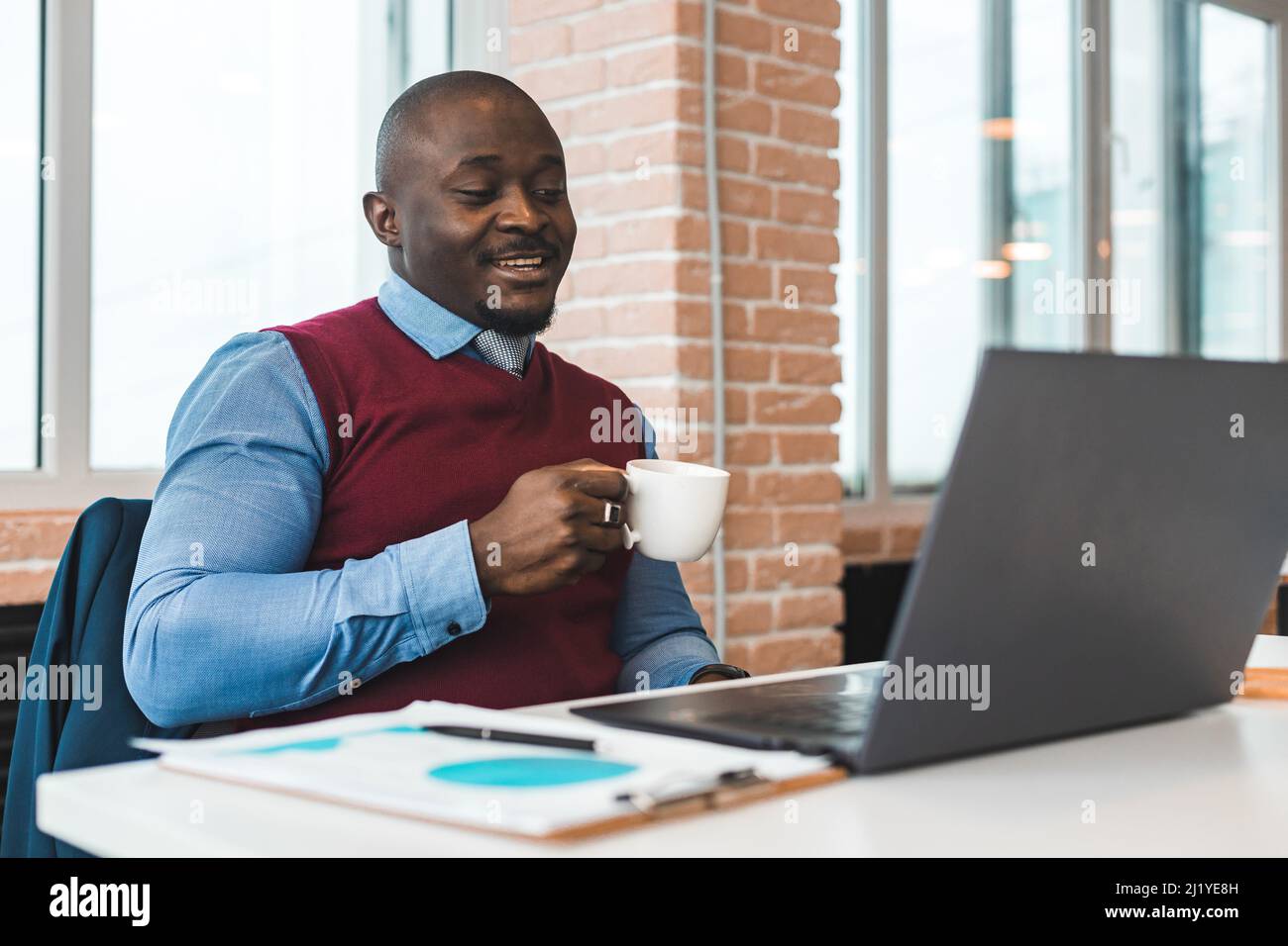 Portrait of an African American in the office. Black man in a business ...
