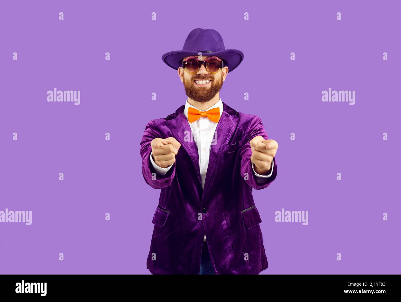 Happy male entertainer point at screen make choice Stock Photo - Alamy