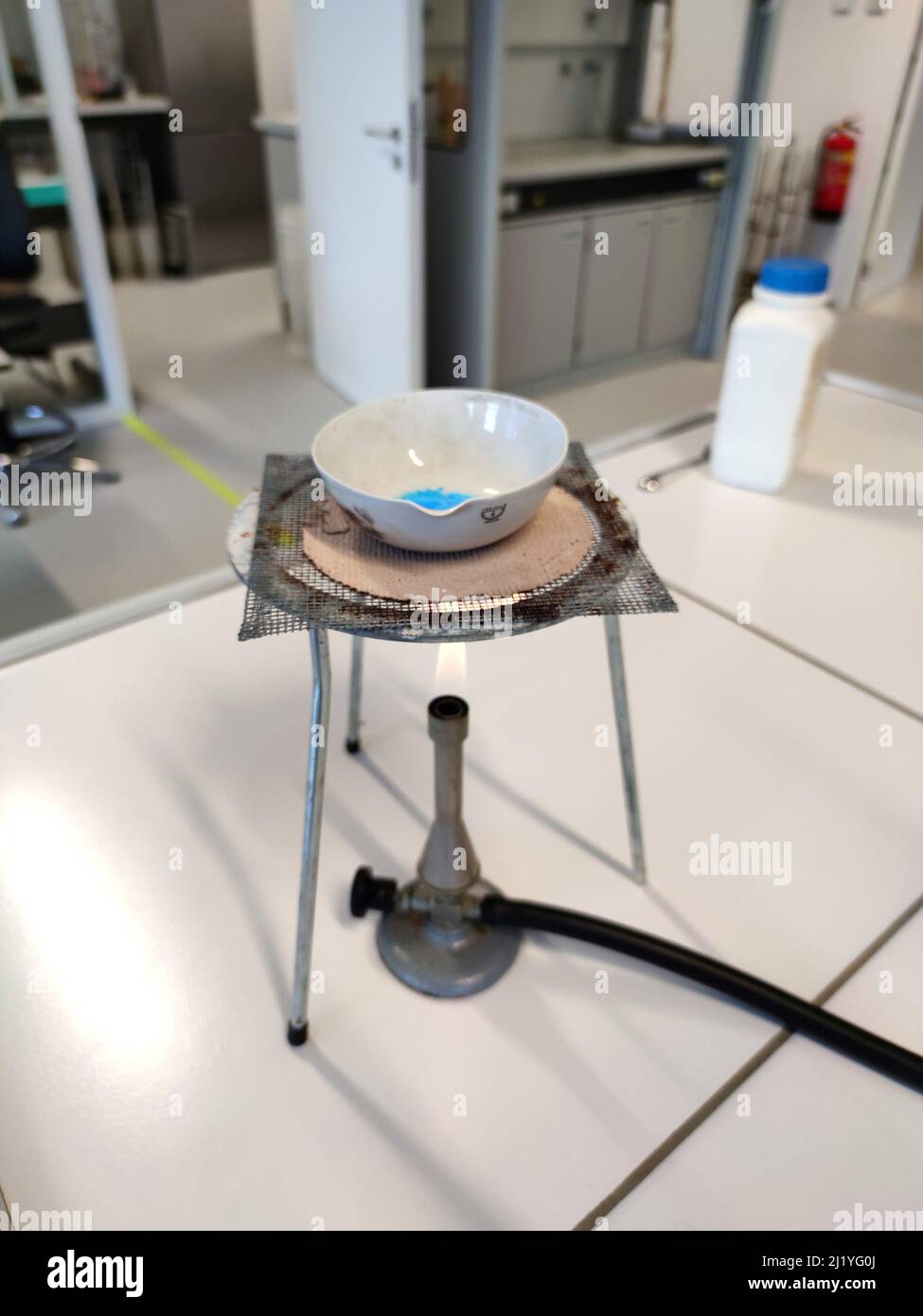 Heating of a chemical substance during chemistry class Stock Photo - Alamy