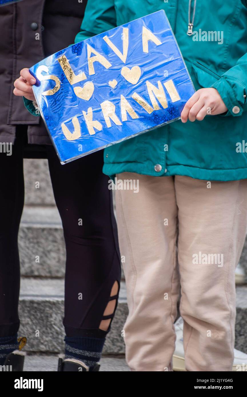 Little girl holding a SLAVA UKRAINI placard at a Rally for Ukraine in ...