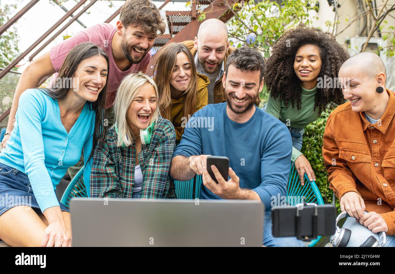 group of diverse people creating content on line looking at the ...