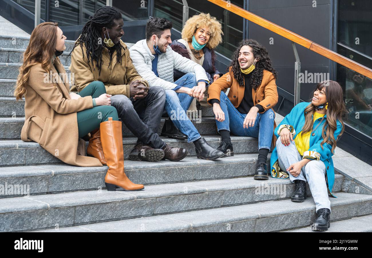 group of friends afro american and caucasian sitting and talking ...