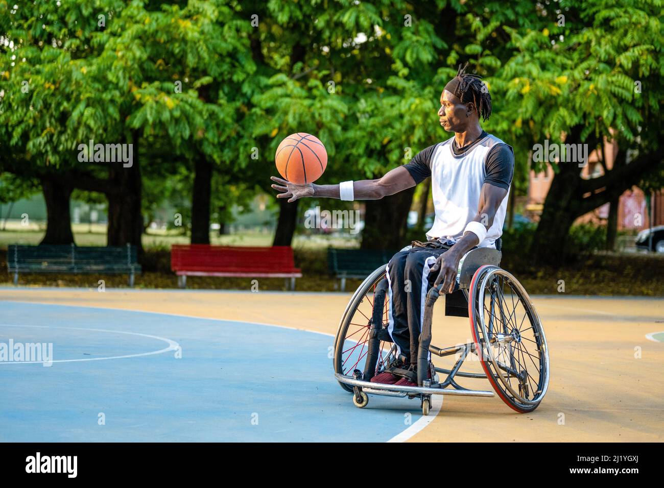 basketball athlete on a wheelchair, african american male with ...