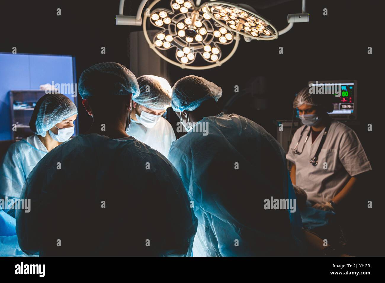 An international professional team of surgeon, assistants and ...