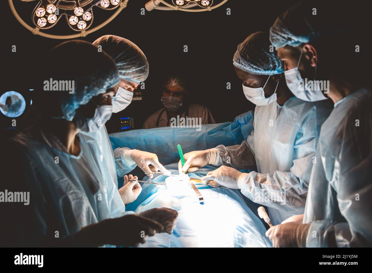 The senior surgeon in the operating room, where the patient is waiting ...