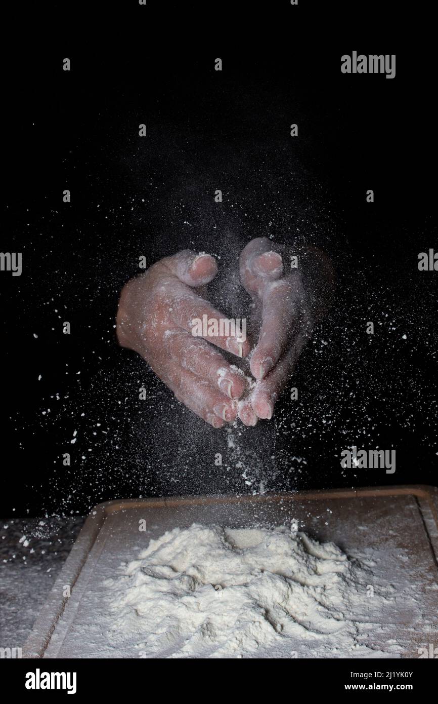 woman hands with flour, clapping Stock Photo - Alamy