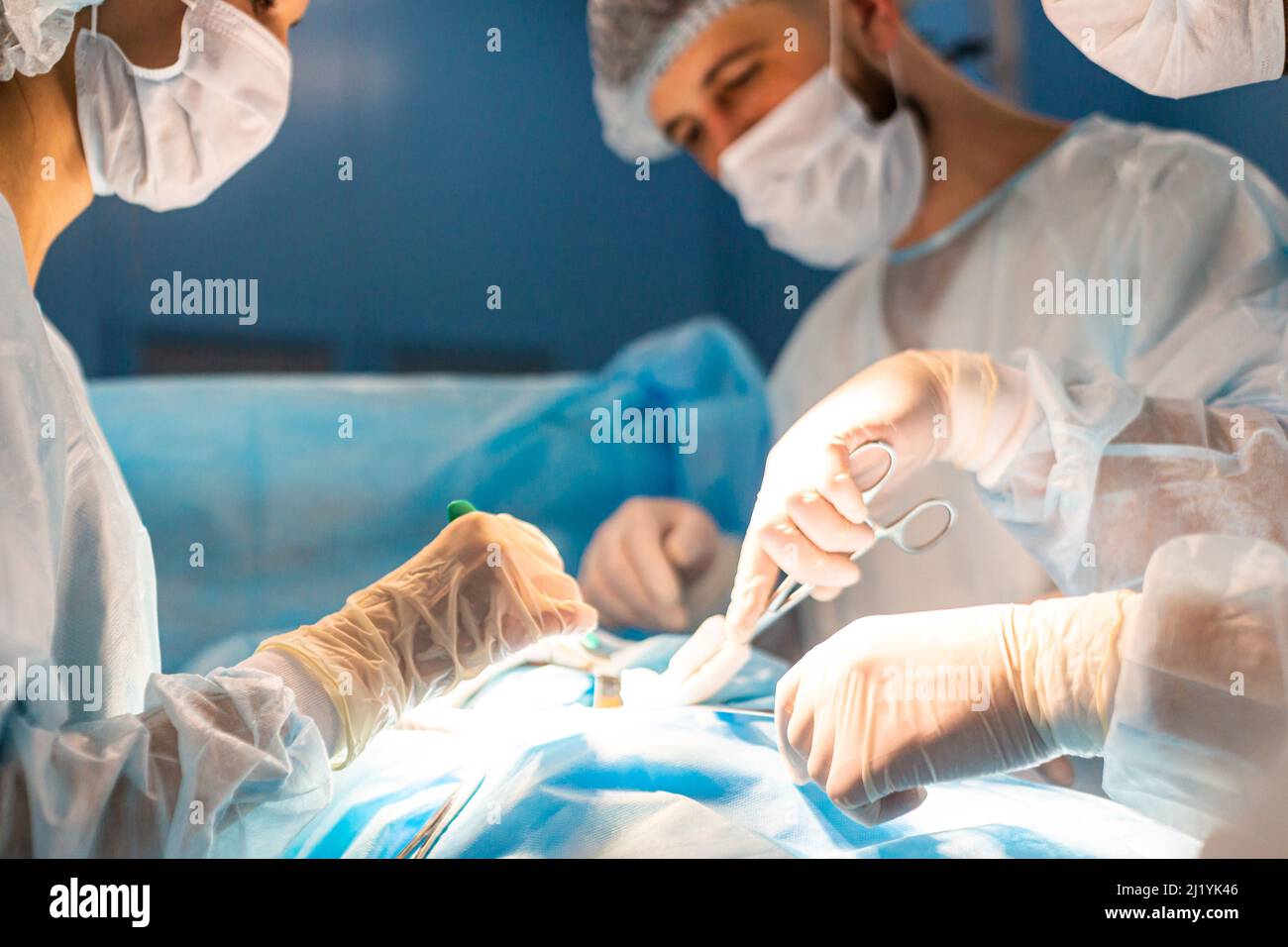 The senior surgeon in the operating room, where the patient is waiting ...