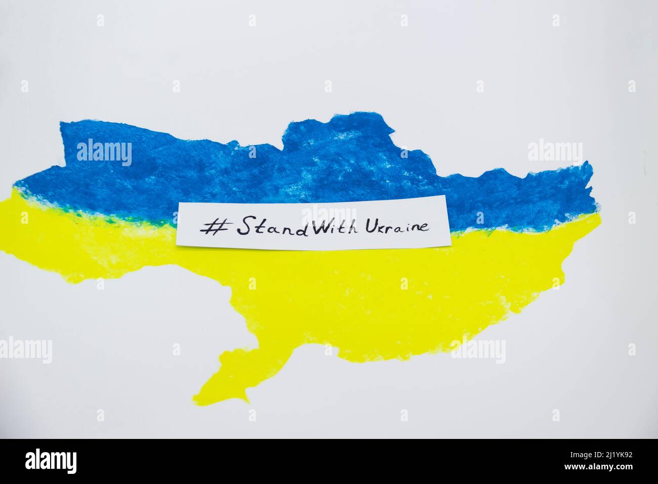 The Ukrainian map in blue and yellow colors with banner on it with ...