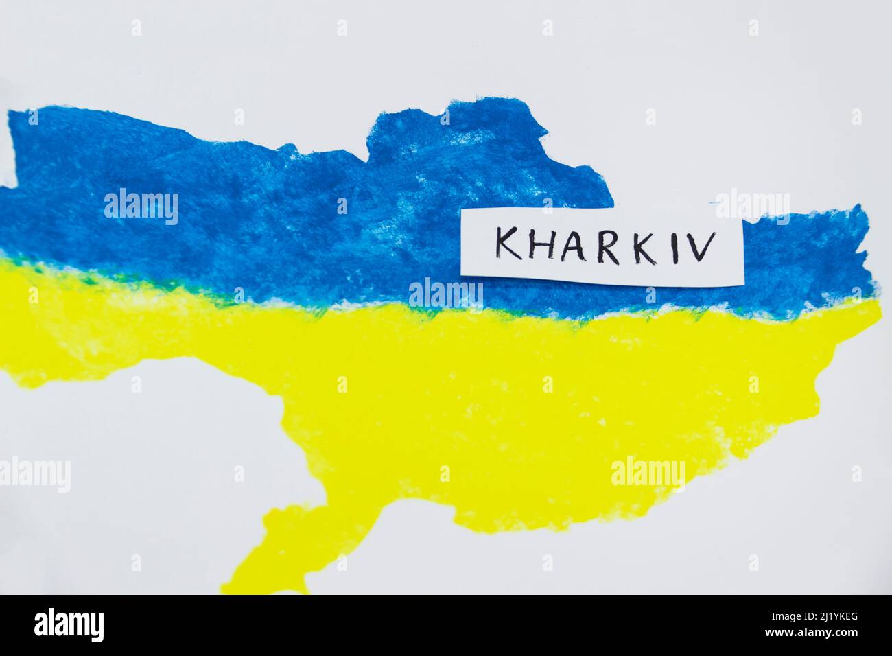 The Ukrainian map in blue and yellow colors with banner on it with word ...